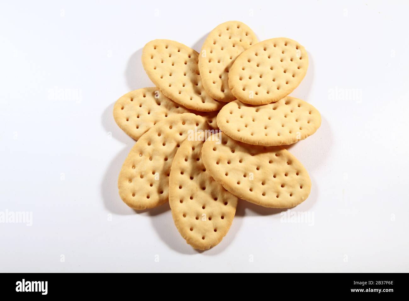 group of crackers shaped like a flower on a white background Stock ...