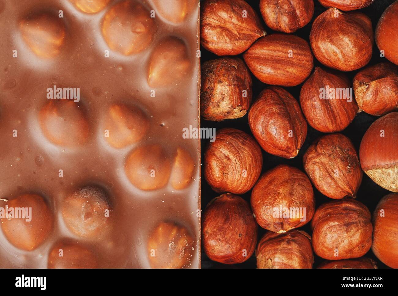 Chocolate with hazelnuts, nuts in a shell in the form of a solid ...