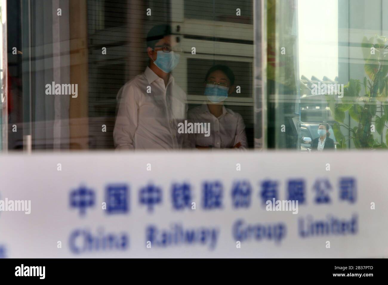 Chinese official persons wearing face masks as a preventive measure ...