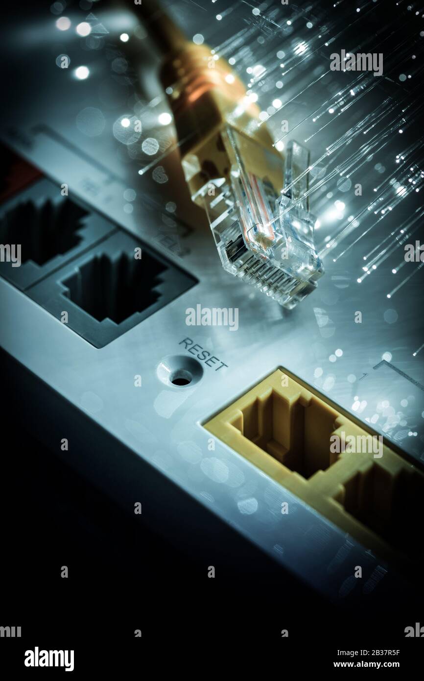 router with network cable and optical fiber Stock Photo - Alamy