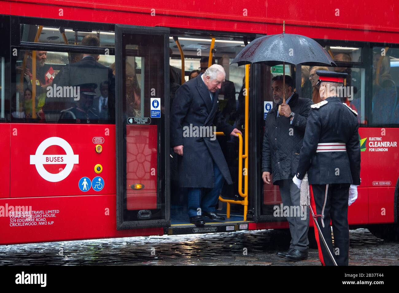 The Prince of Wales steps off an electric bus as he and Duchess of ...