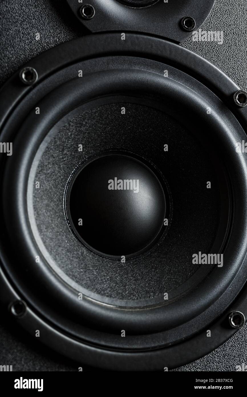 Multimedia speaker system speaker close-up on a black background. A ...