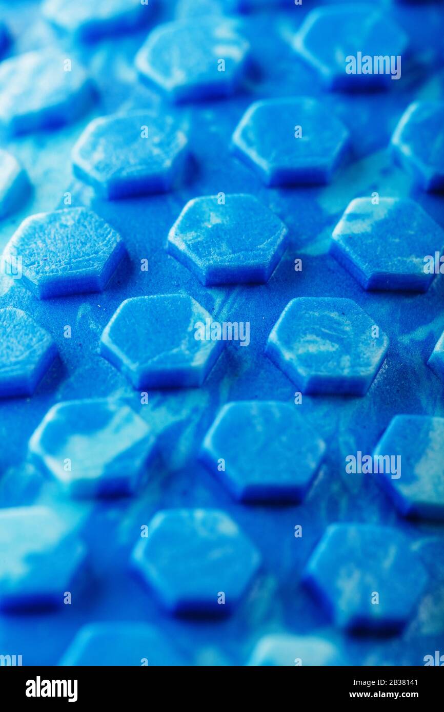 Abstract texture of a blue massage roller in the form of blue hexagonal ...