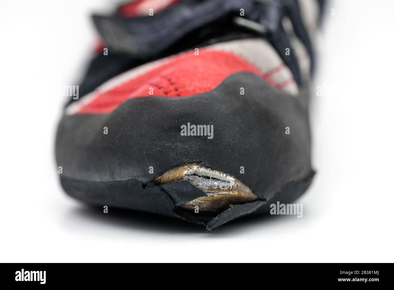 Worn climbing shoe requiring a full upper rubber replacement, isolated ...