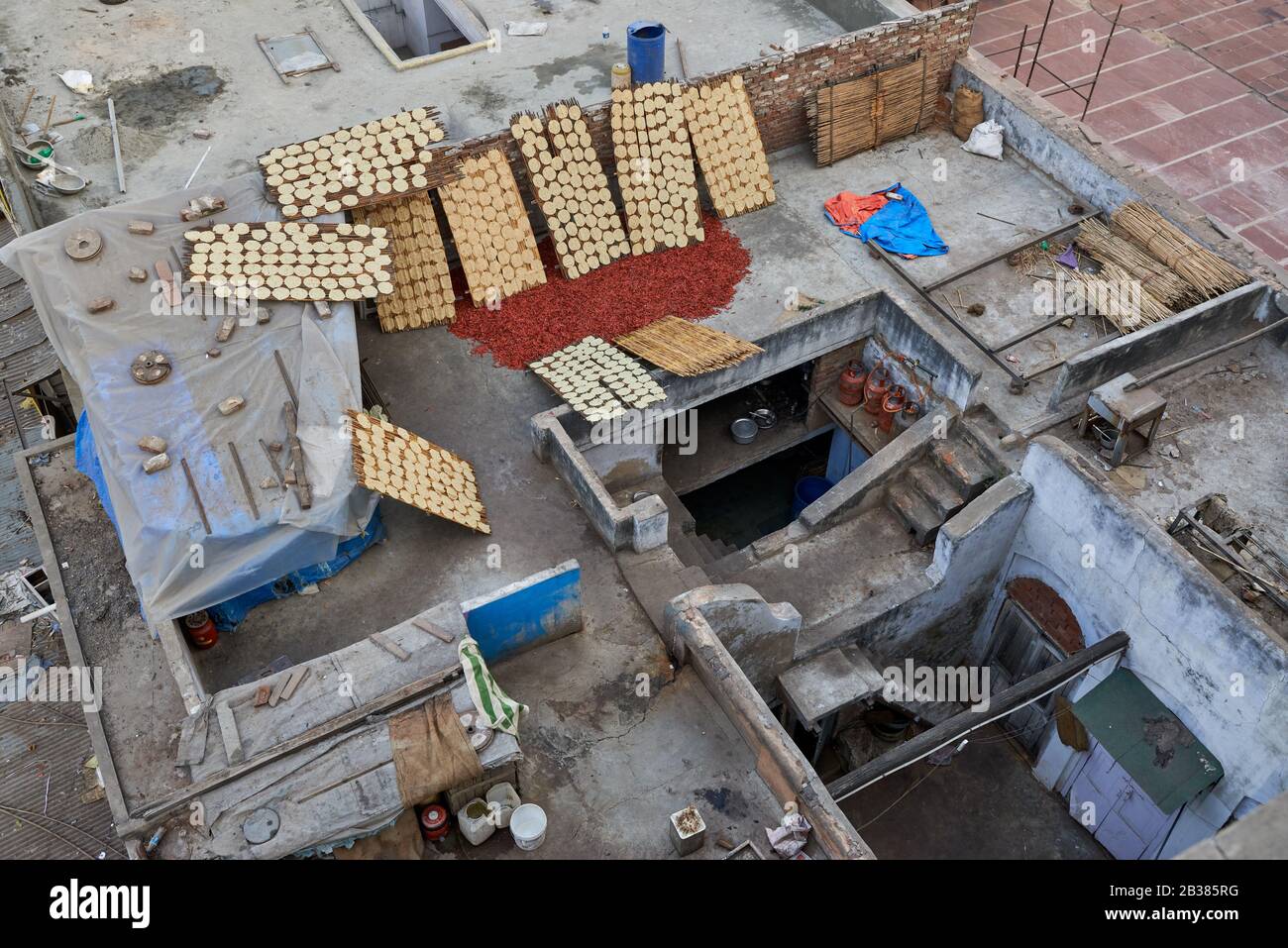 food is drying on a roof of Old Dehli spice market, Delhi, India Stock ...