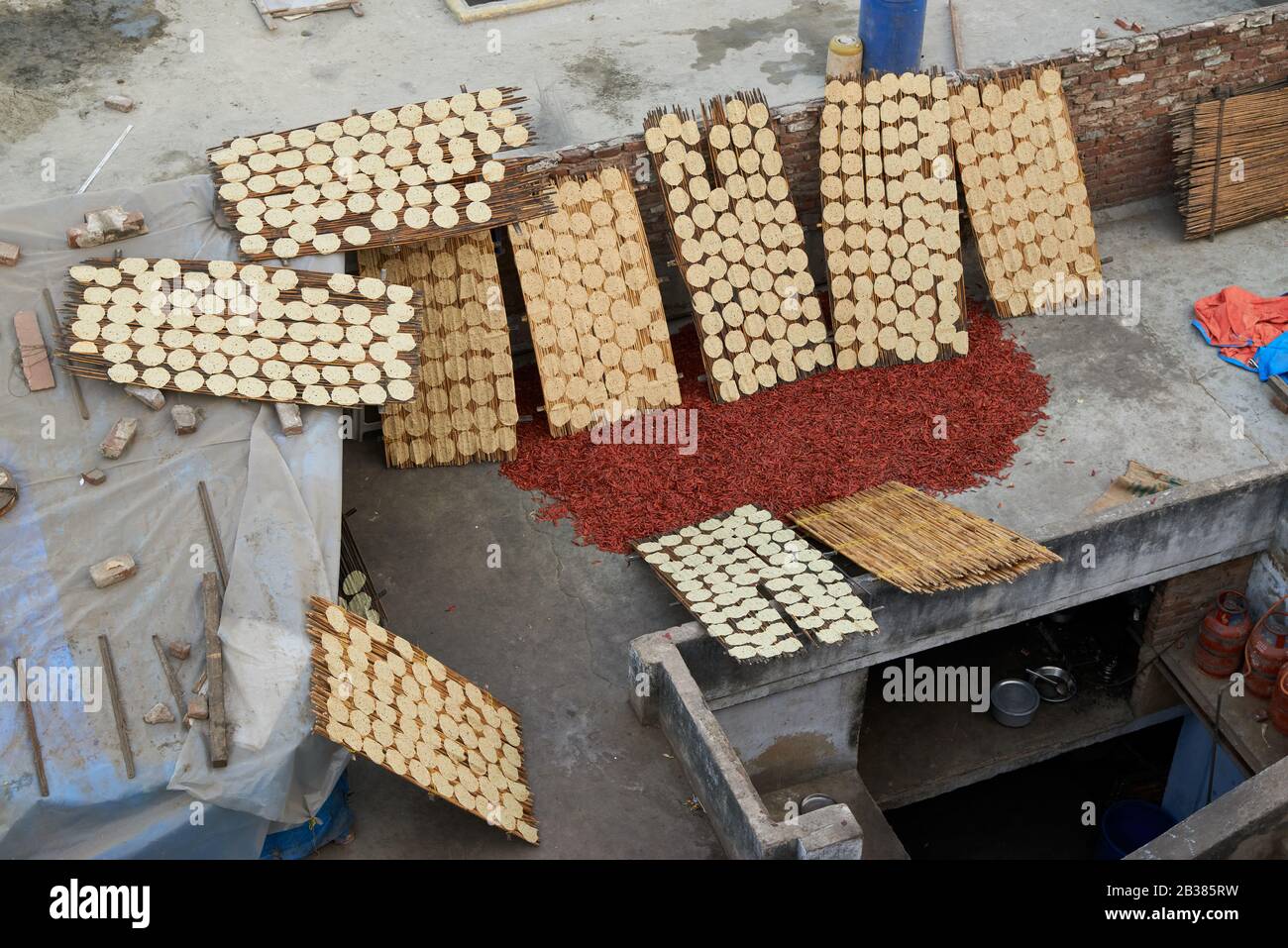 food is drying on a roof of Old Dehli spice market, Delhi, India Stock ...