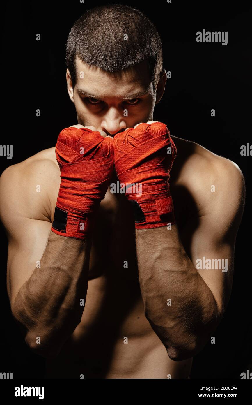 Boxer male fighter posing in confident defensive stance with hands in ...