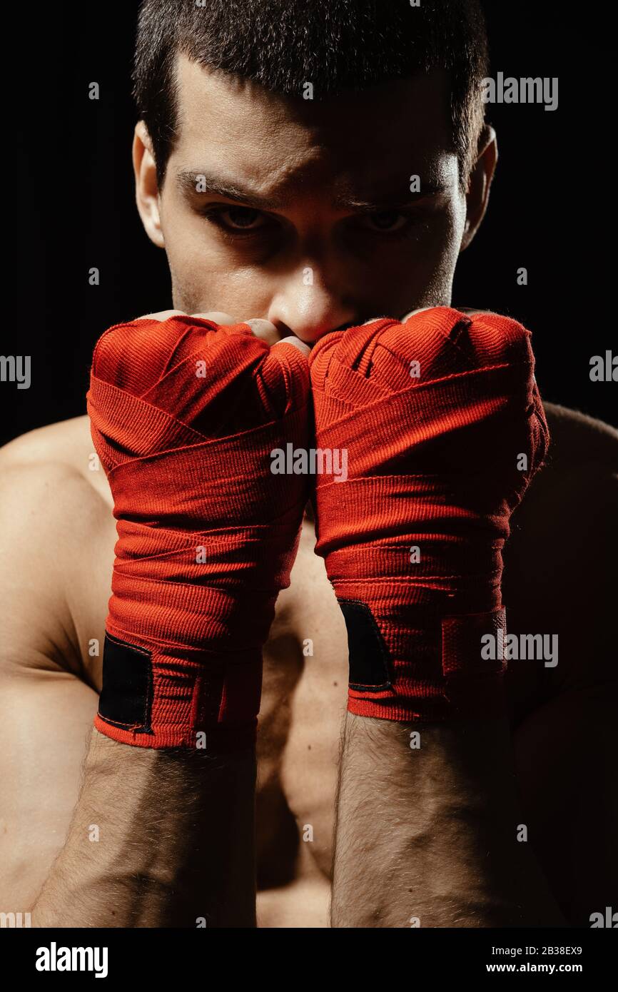 Boxer male fighter posing in confident defensive stance with hands in ...