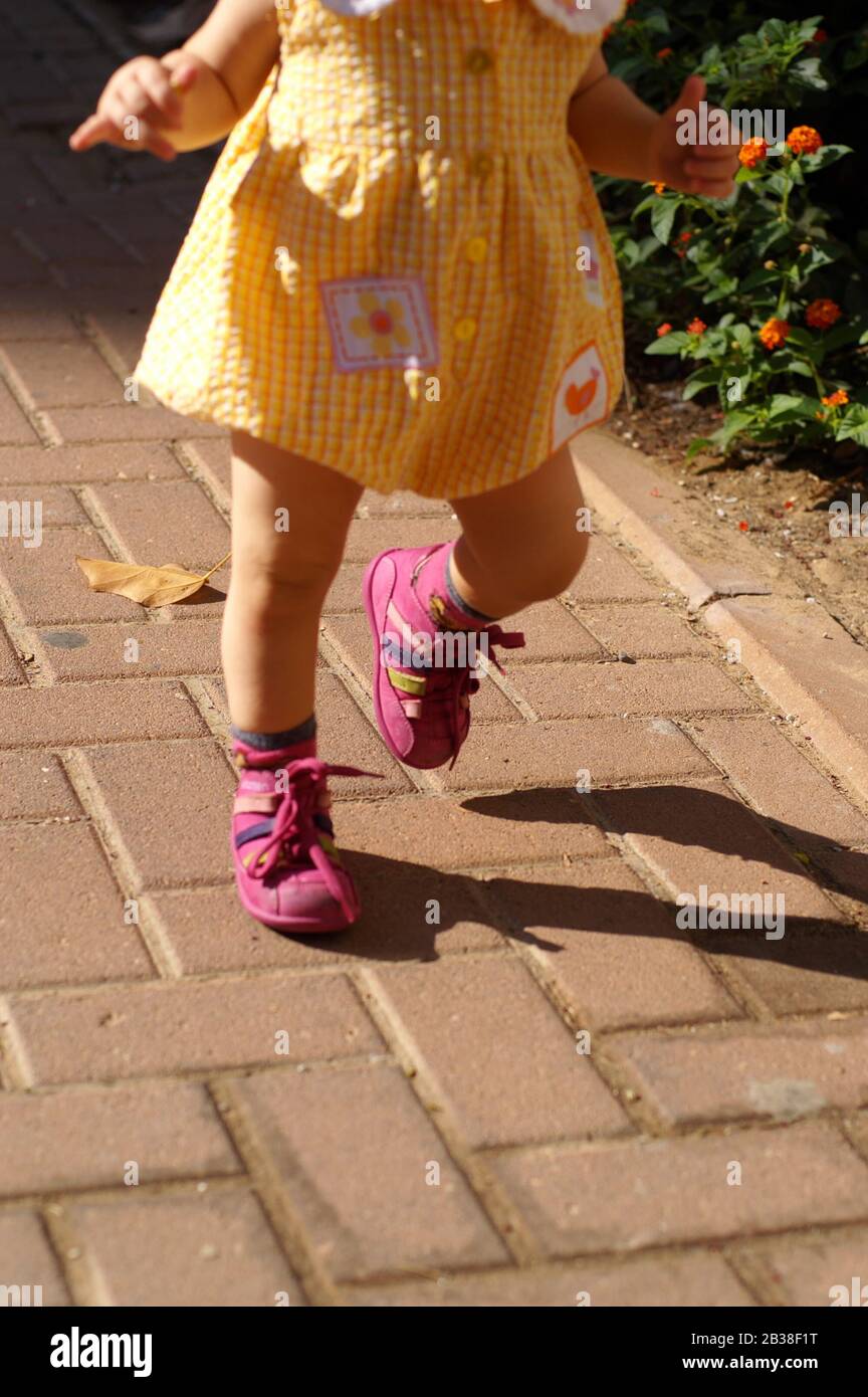 First steps of a little child girl Stock Photo - Alamy