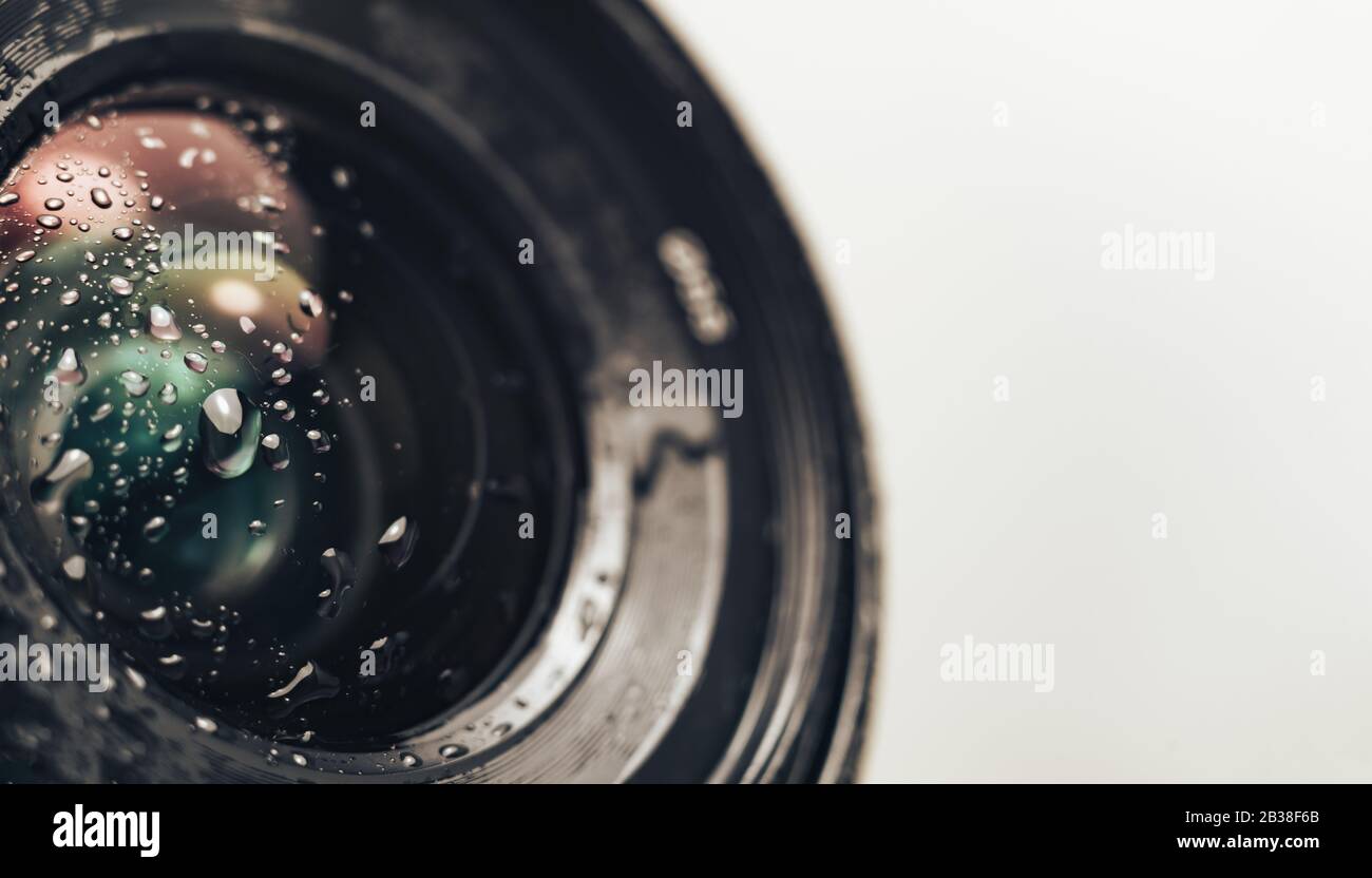Close up beautiful Camera lens of drop water, on a white Background ...