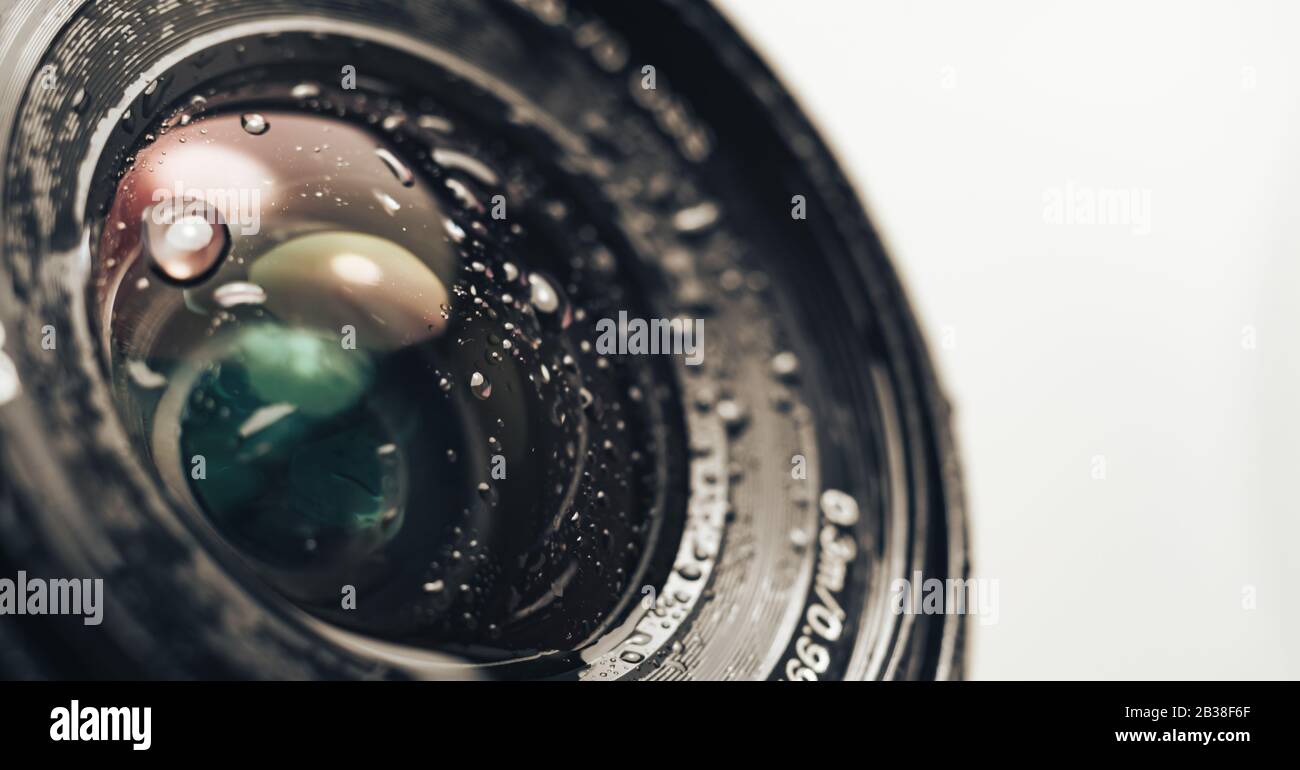 Close up beautiful Camera lens of drop water, on a white Background ...