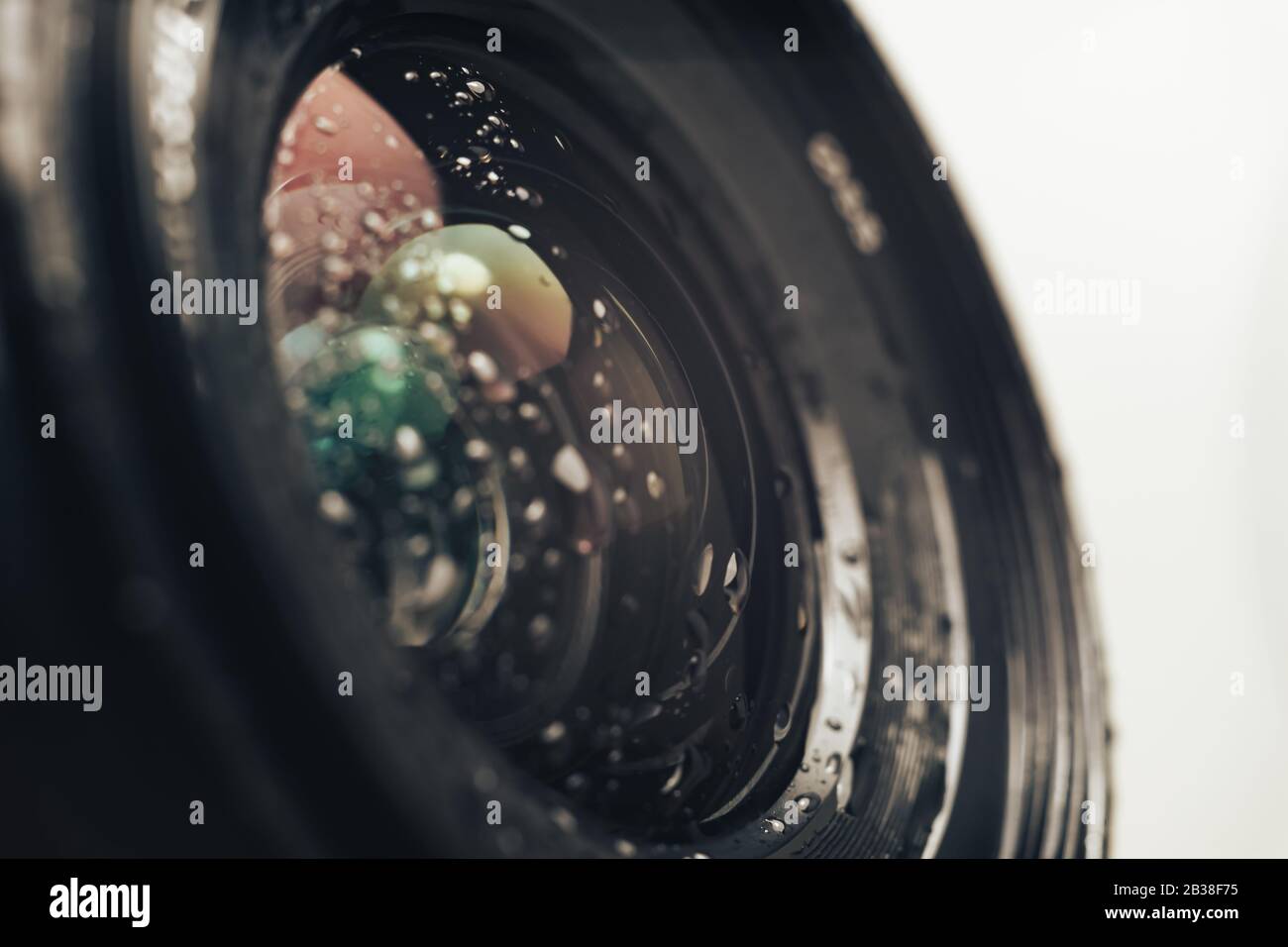 Close up beautiful Camera lens of drop water, on a white Background ...