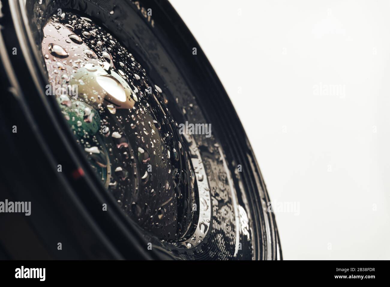 Close up beautiful Camera lens of drop water, on a white Background ...