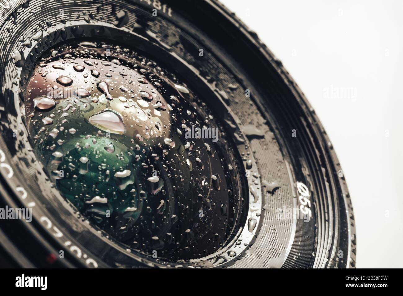 Close up beautiful Camera lens of drop water, on a white Background ...