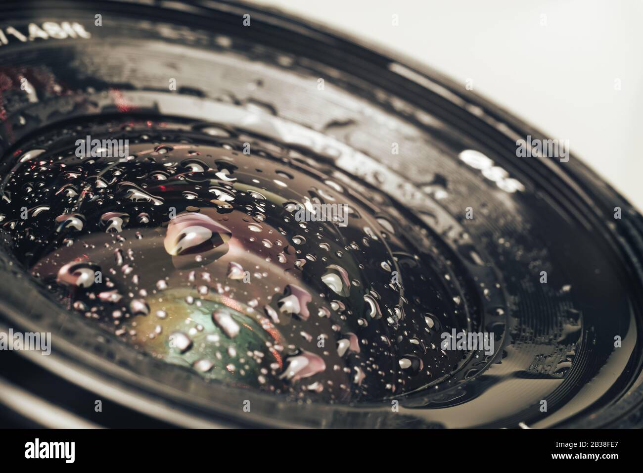 Close up beautiful Camera lens of drop water, white light. Background ...
