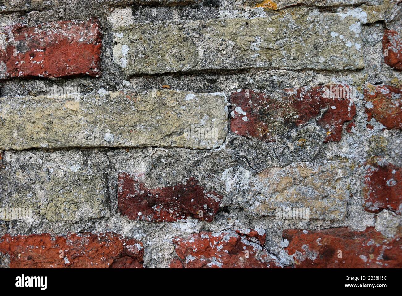 Old tudor brick wall in close up with narrow red and yellow bricks and ...