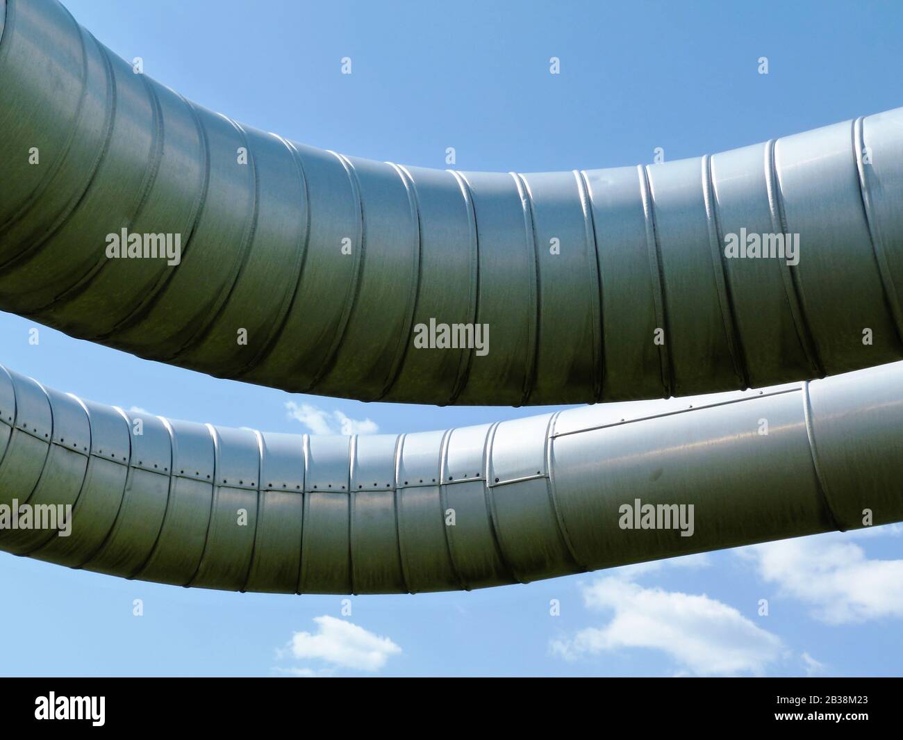 overhead pipeline elbow detail in low angle view with expansion ...