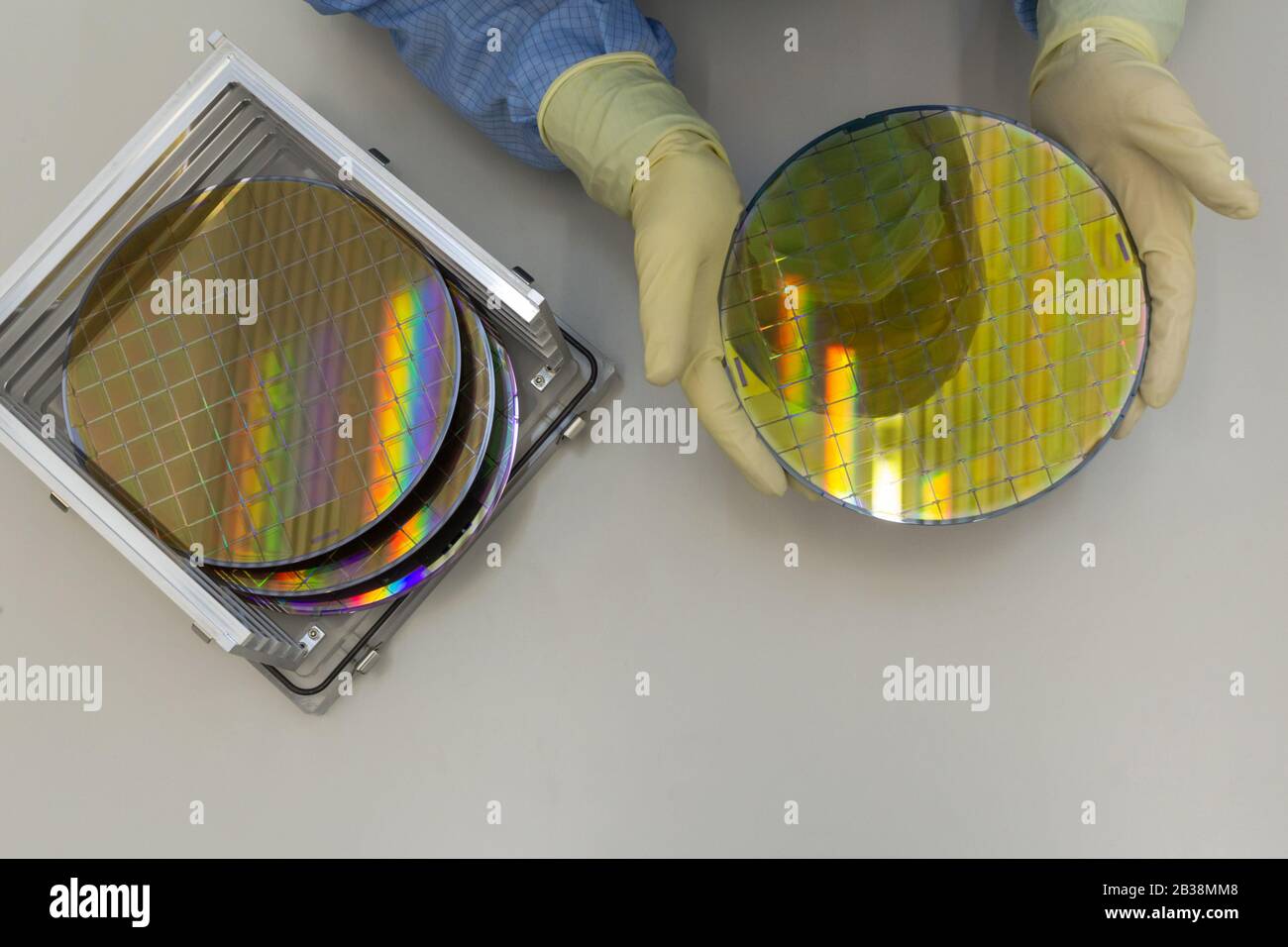 Silicon Wafers in steel holder box take out by hand in gloves- A wafer ...