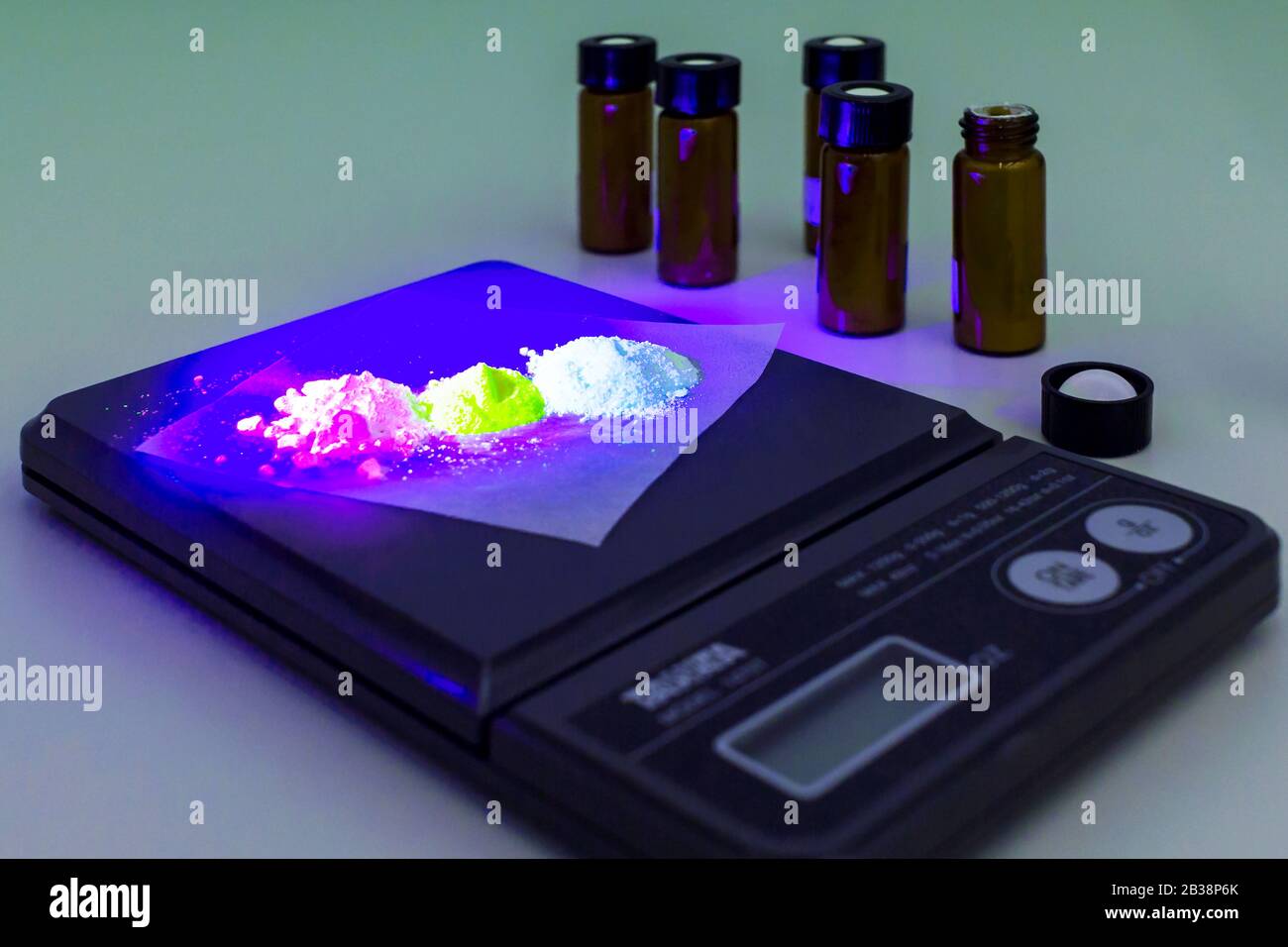 The laboratory scale of black color on table with organic material on ...