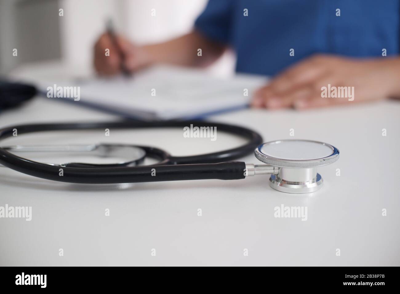 Doctor's working table. Focus on stethoscope. Female medicine doctor ...