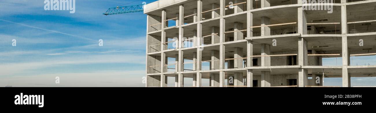 Panorama of Aerial view of concrete frame of tall apartment building ...