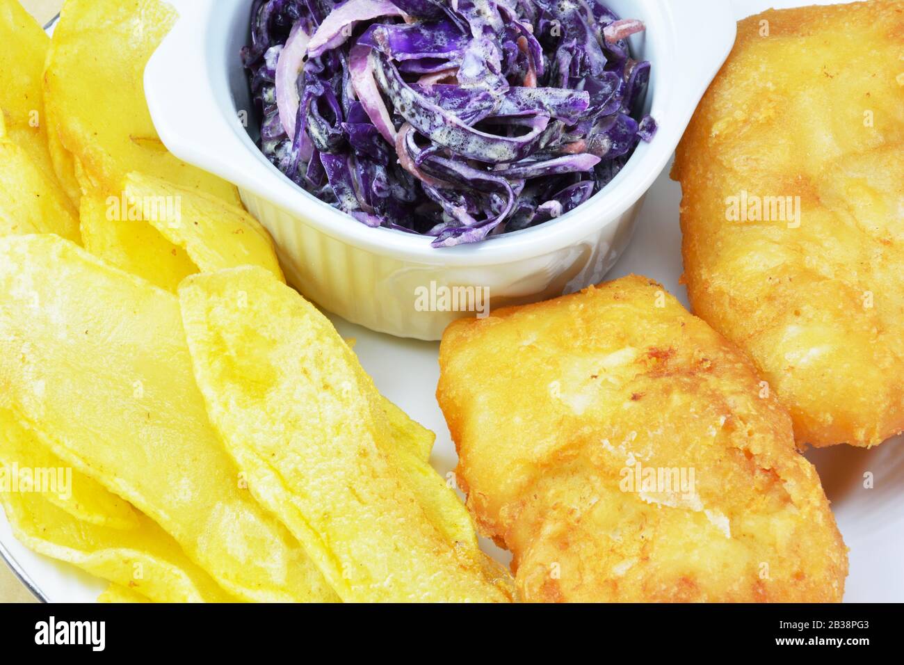 Cod fish , french fries and red cabbage salad with mayonnaise Stock ...
