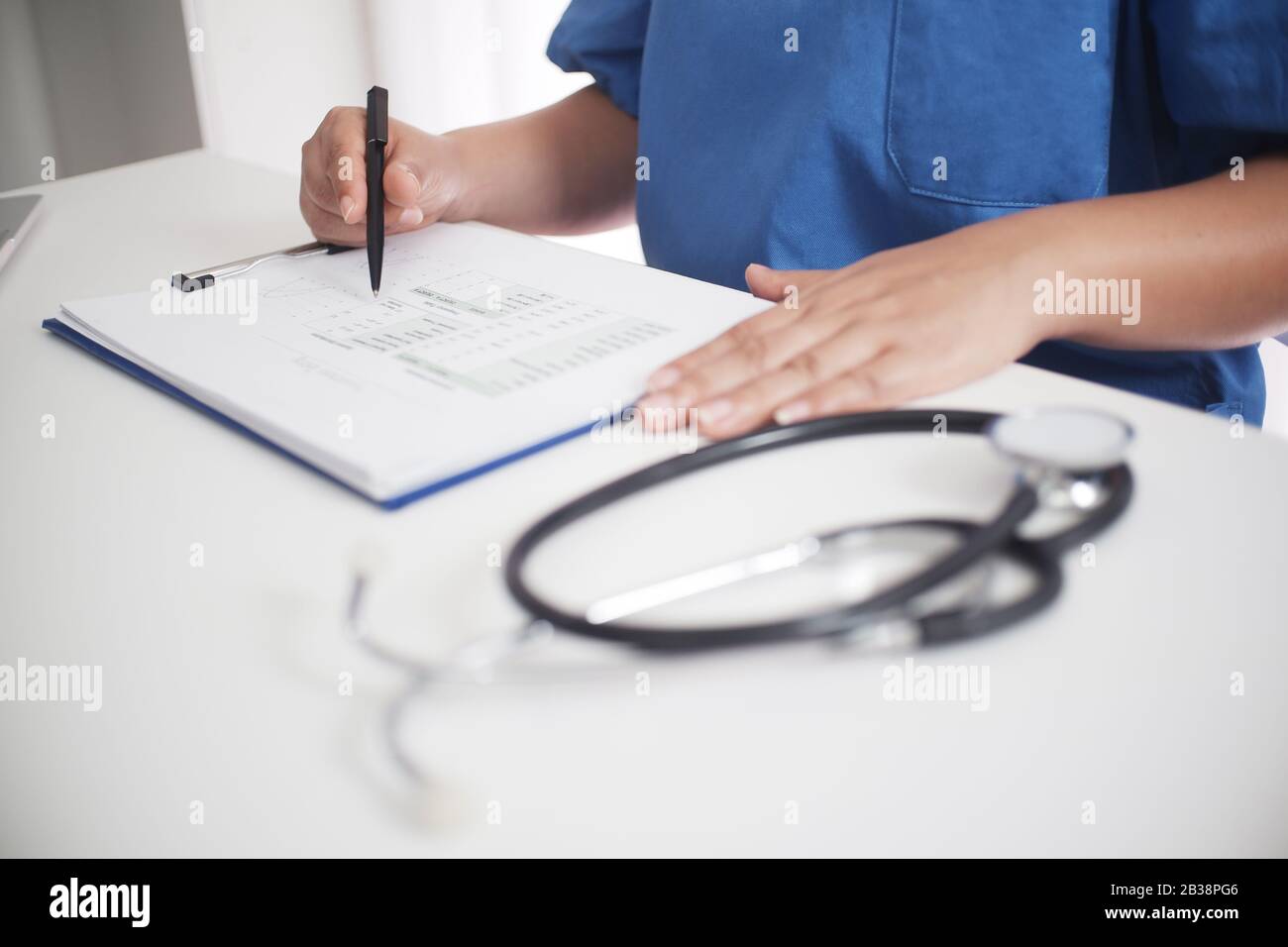 Doctor's working table. Focus on stethoscope. Female medicine doctor ...