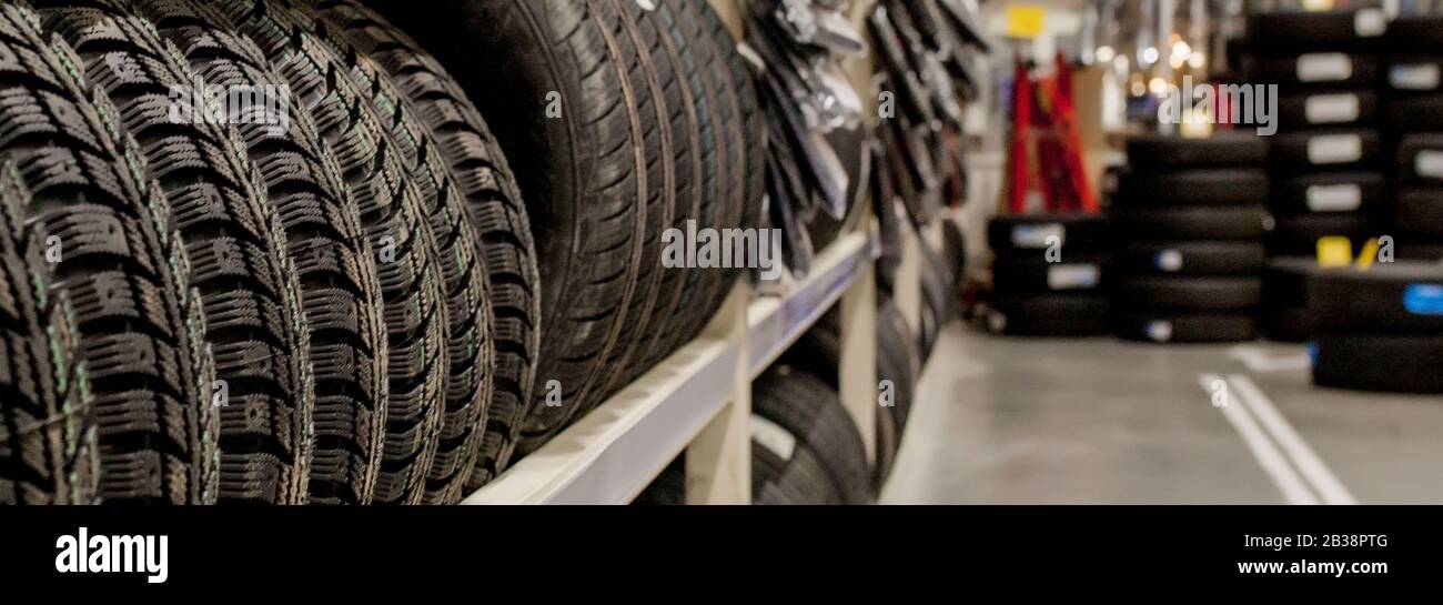Car tires and wheels at warehouse in tire store Stock Photo - Alamy