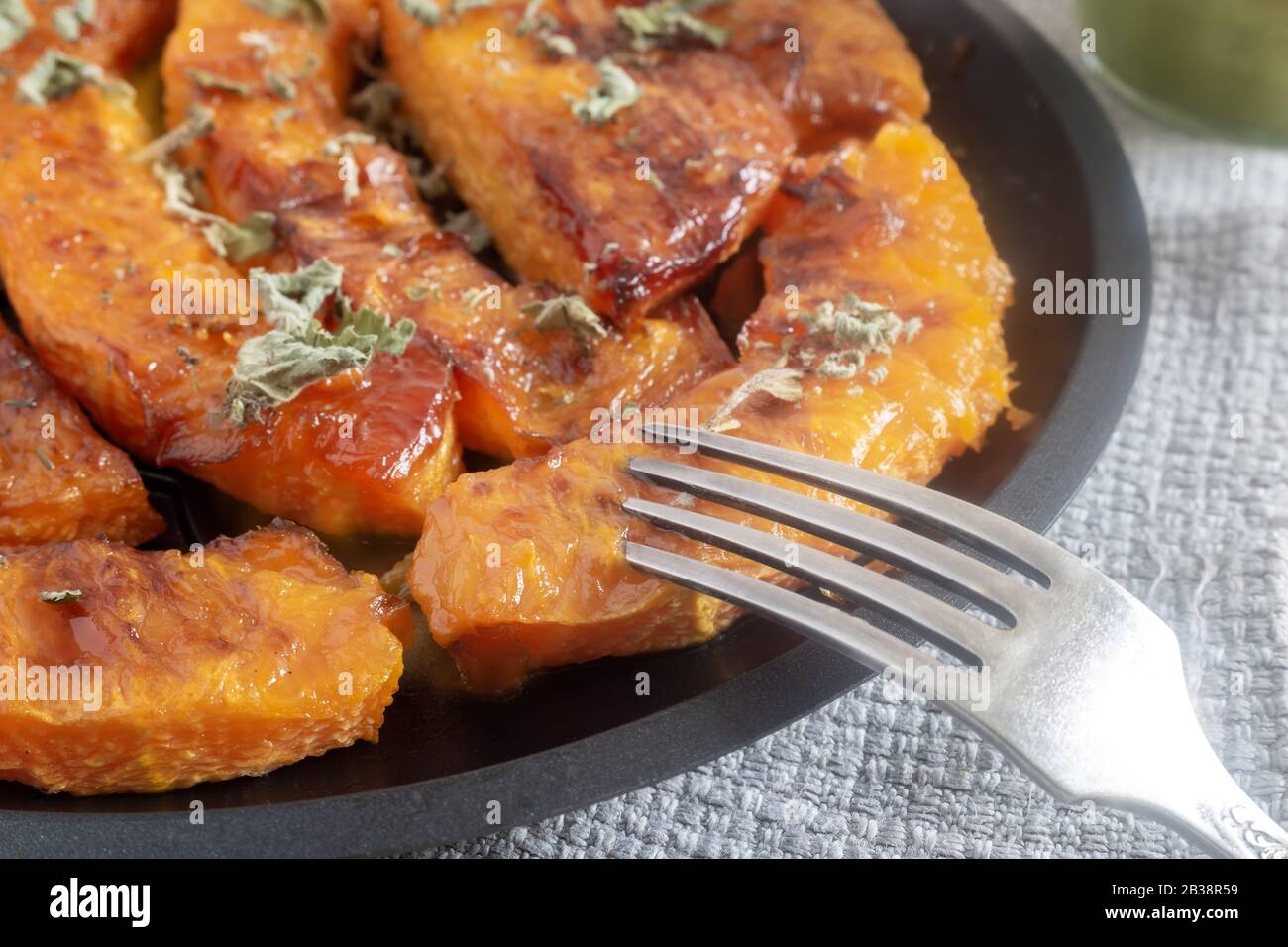 Pumpkin slices baked with honey and herbs Stock Photo - Alamy
