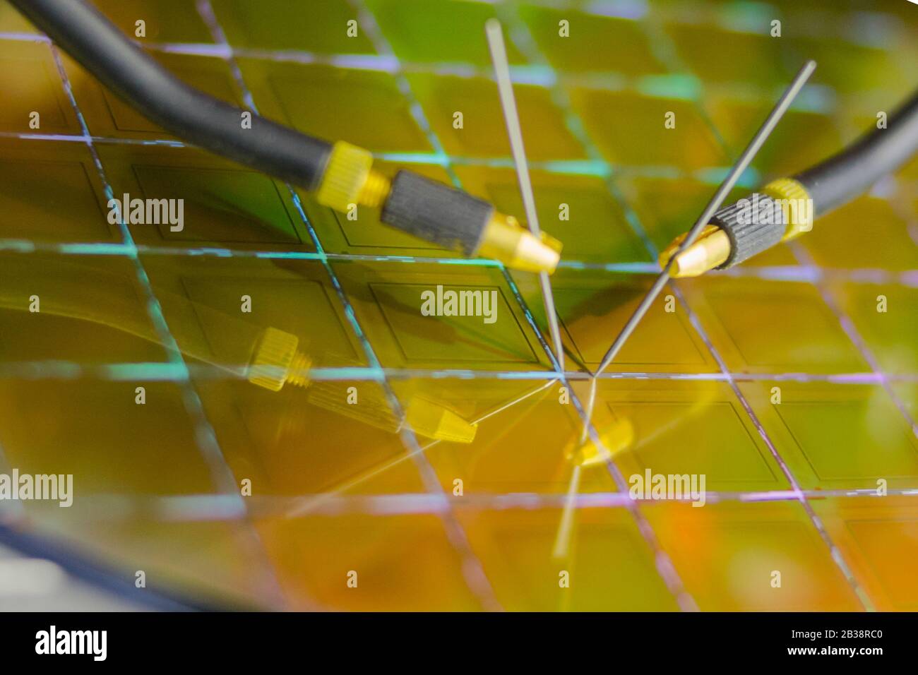 Checking microchips on silicon wafer with probe station.Microelecronics ...
