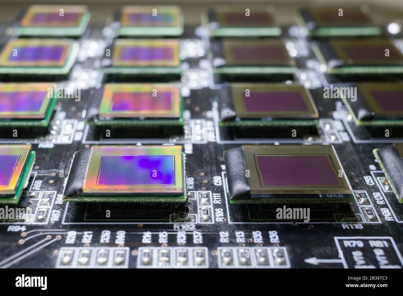The process of checking several oled displays on the test station. The ...