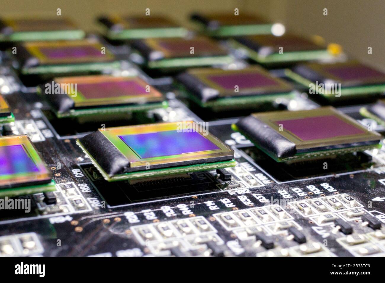 The process of checking several oled displays on the test station. The ...