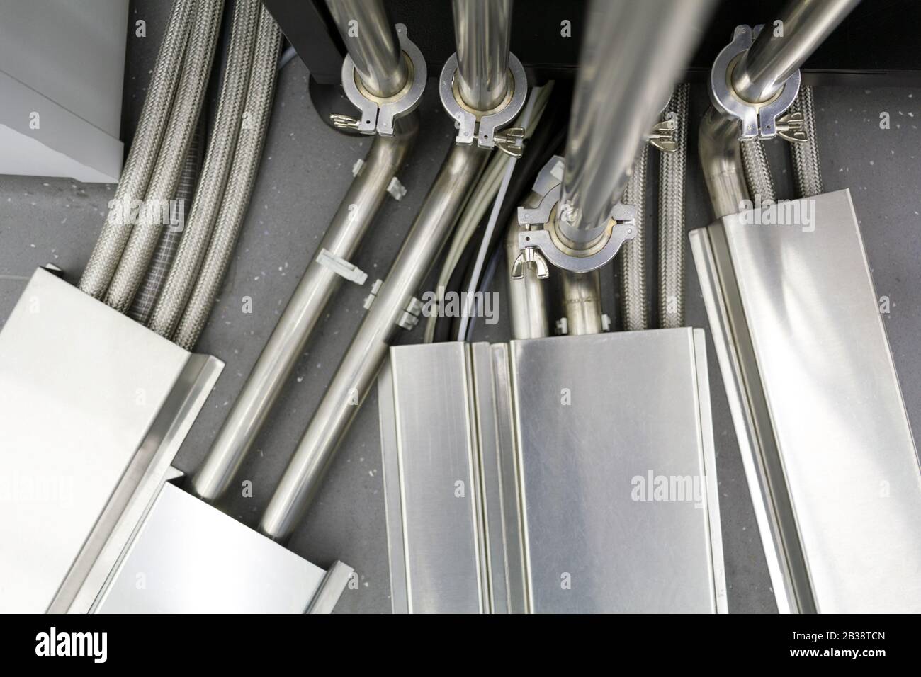 Fragment of a complex connection of many steel tubes and wires between ...