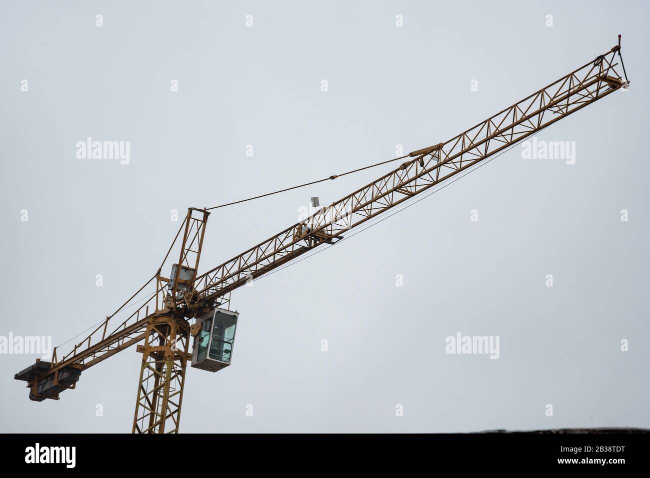 Isolated empty construction crane on a cloudy and rainy day Stock Photo ...