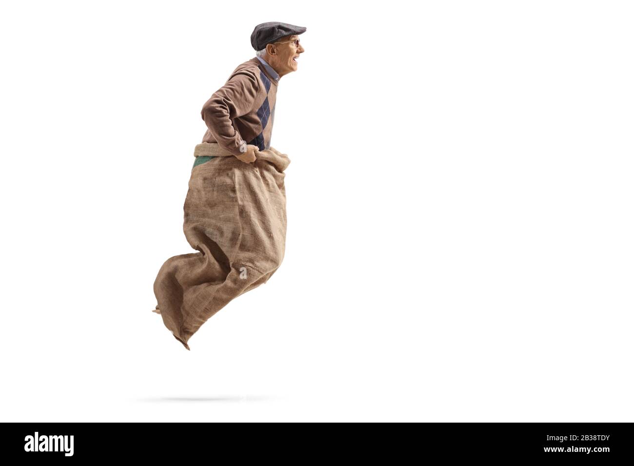 Profile shot of a senior man jumping in a sack isolated on white ...