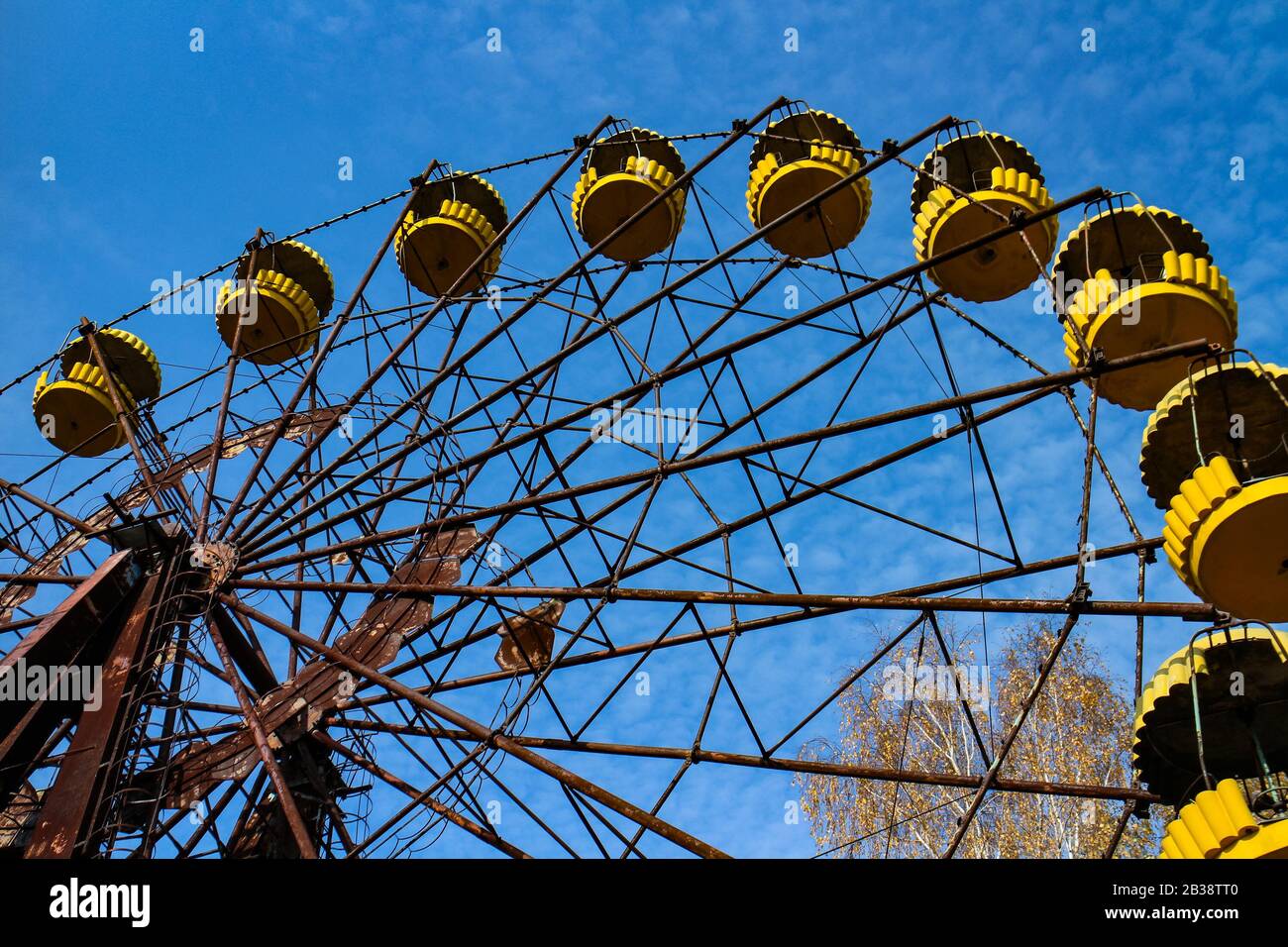 The iconic yellow ferris wheel of the abandoned amusement park of ...