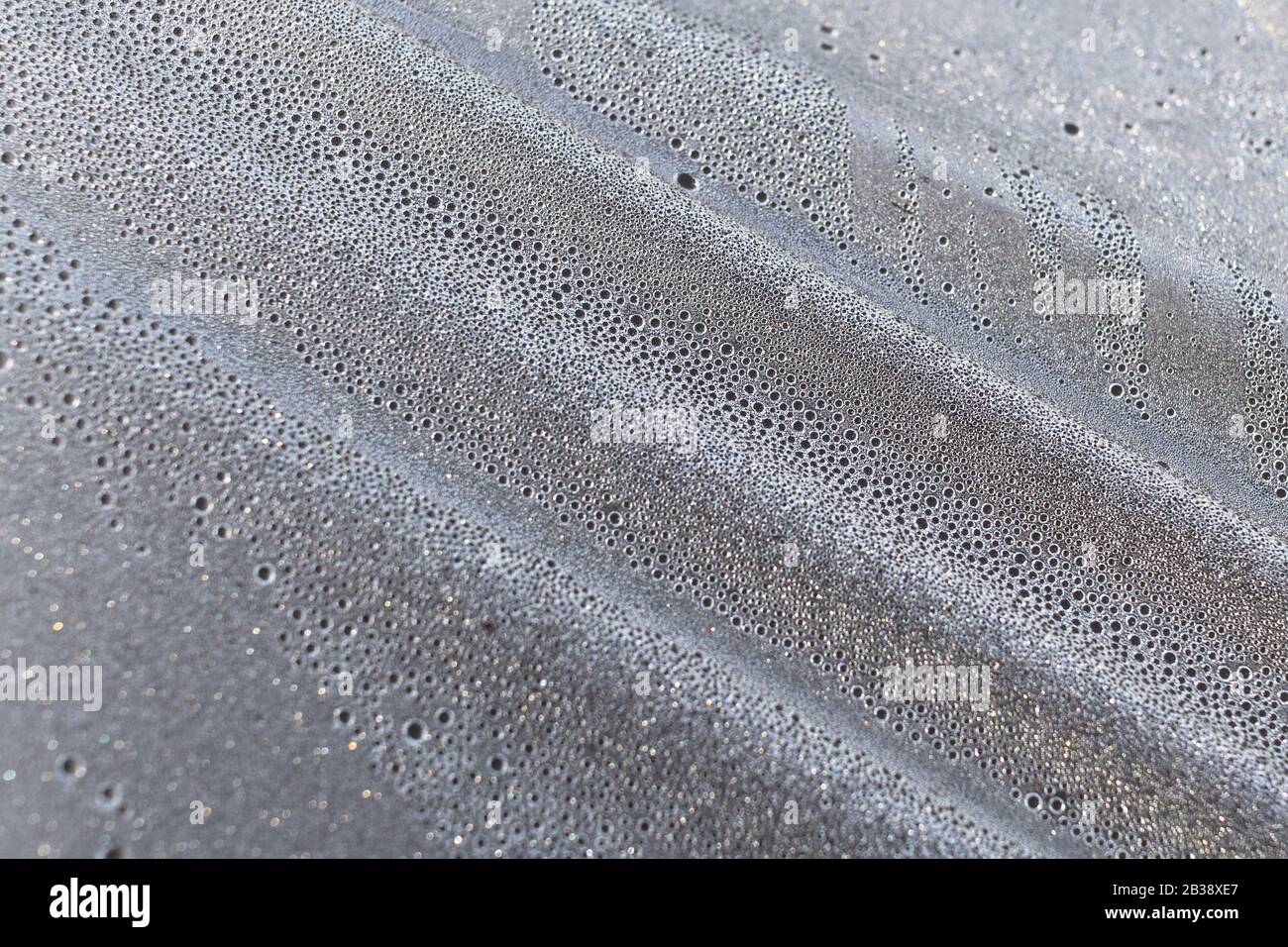 Background of the condensate drops on the film is polyethylene. Water ...