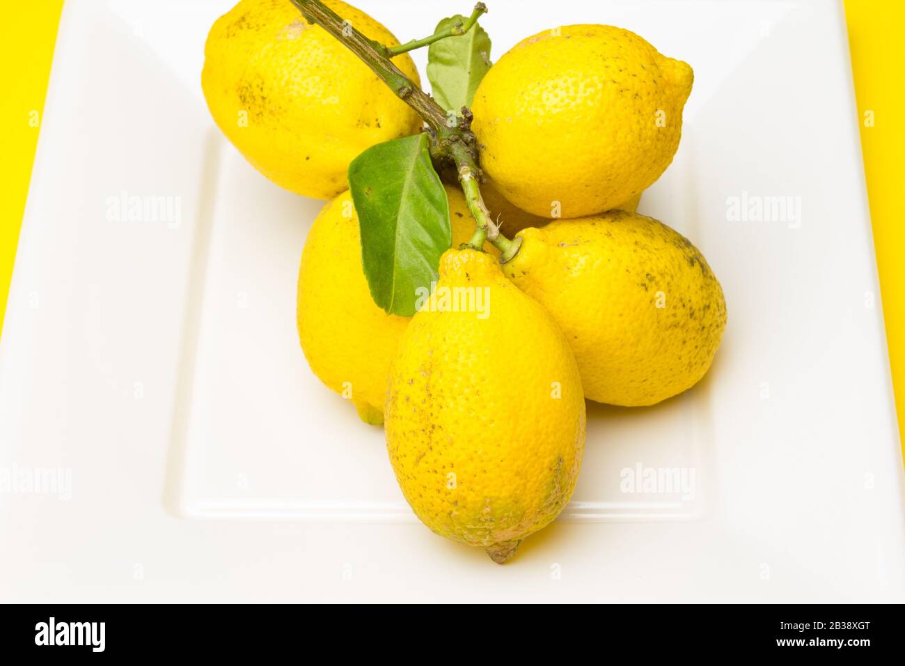 Lemon is a citrus fruit with yellow skin, with an acidic flavor from ...
