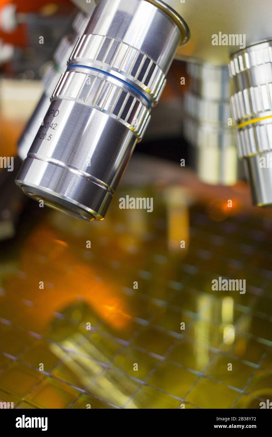 Checking microchips on silicon wafer with probe station and microscope ...