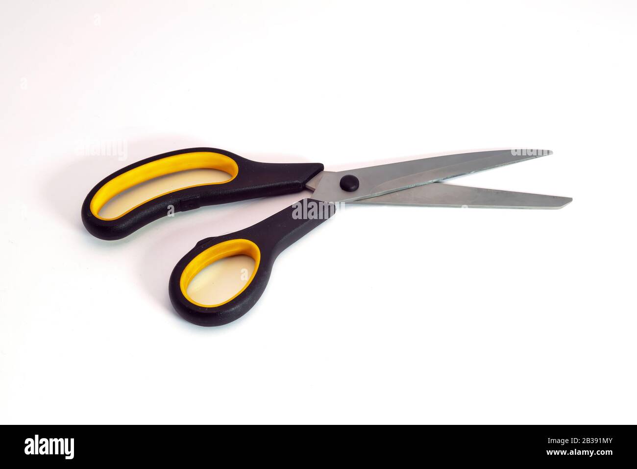 Modern metal scissors on a white background Stock Photo - Alamy