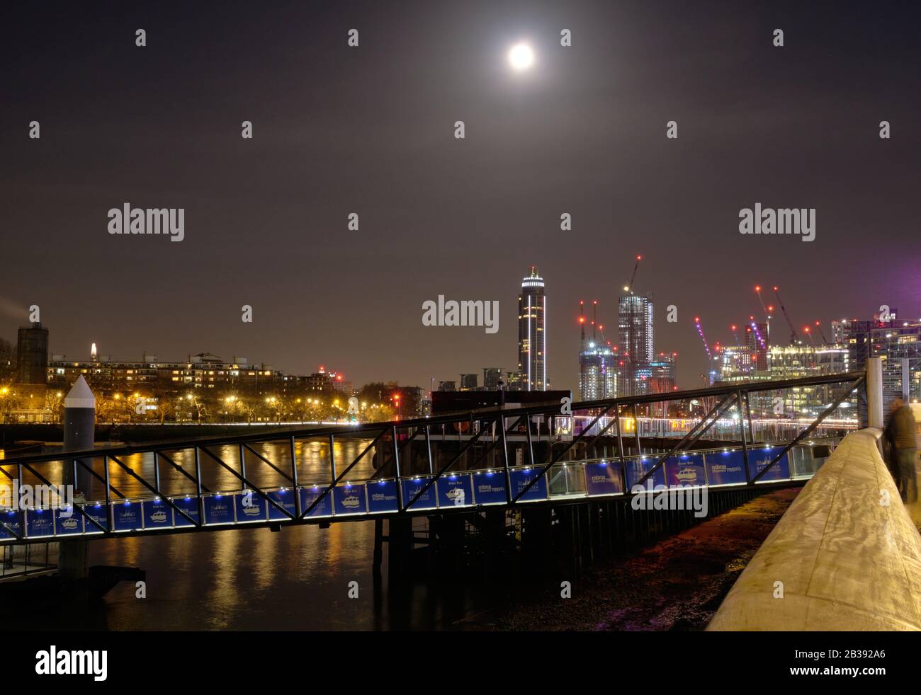 Battersea Pier bridge and nine elms in the distance at night Stock ...