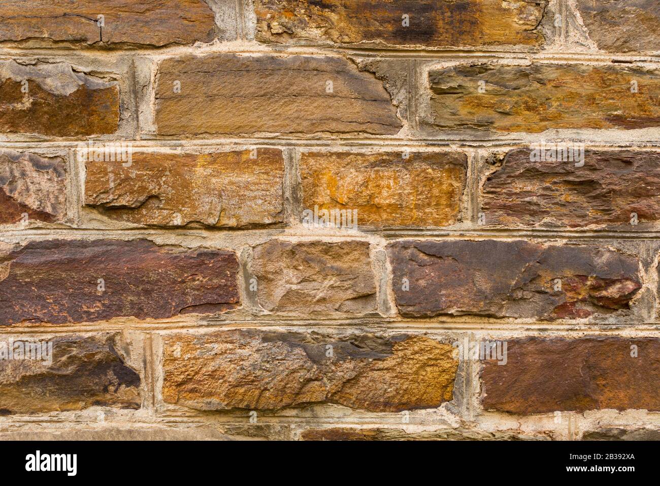 Old vintage stone wall from brown medieval stone Stock Photo - Alamy