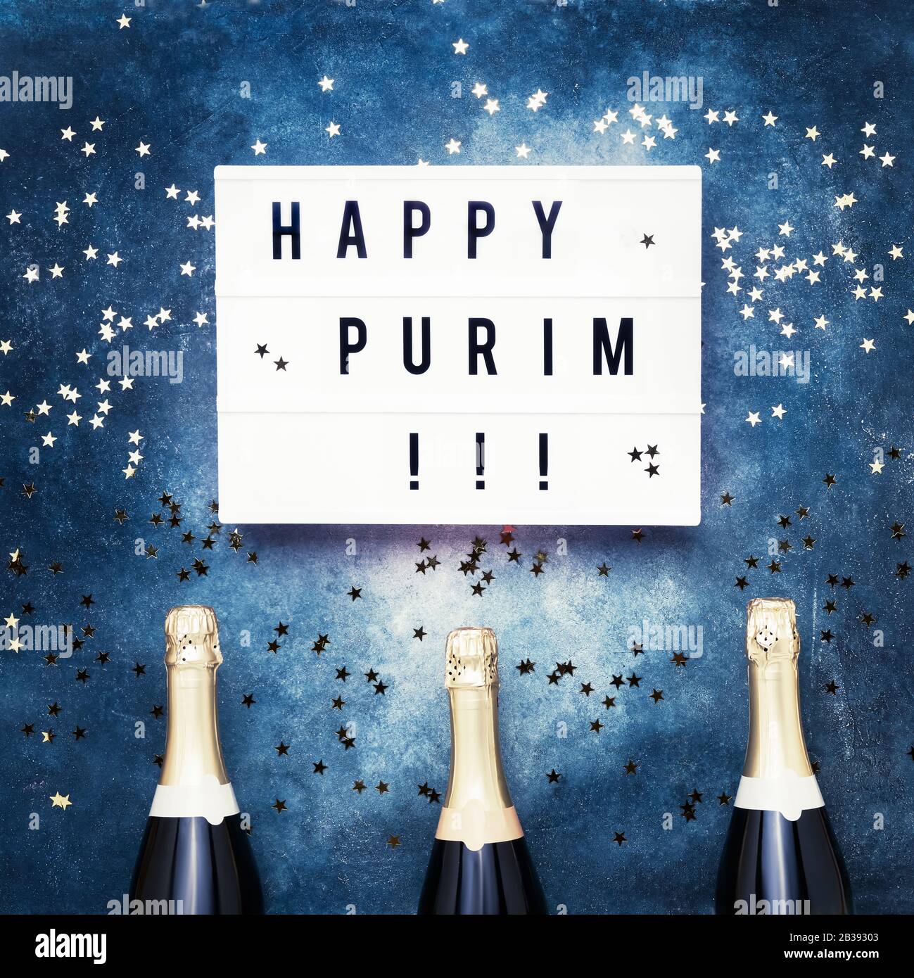 Flat lay of Purim Carnival celebration concept. "Happy Purim" written ...