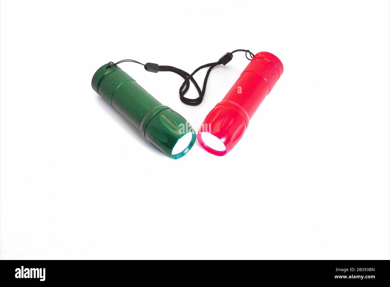 Portable LED flashlights red and green color isolate on a white ...