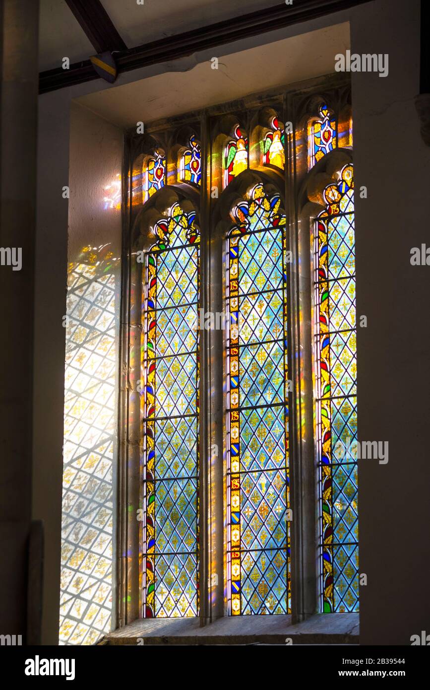 Stained glass reflections in St. Andrew's Church in Castle Combe ...