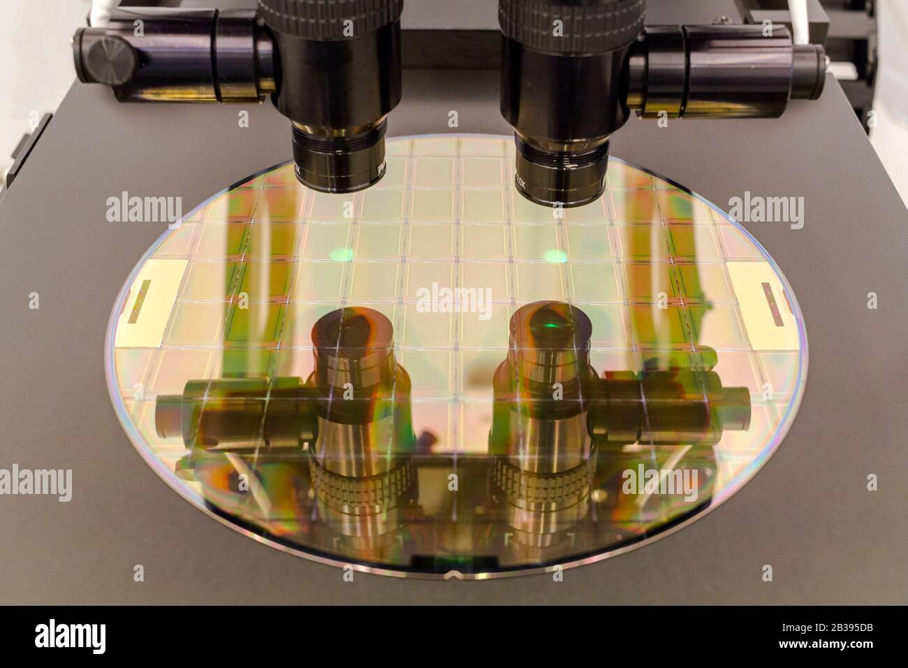 Silicon wafer on machine process examining in microscope Stock Photo ...