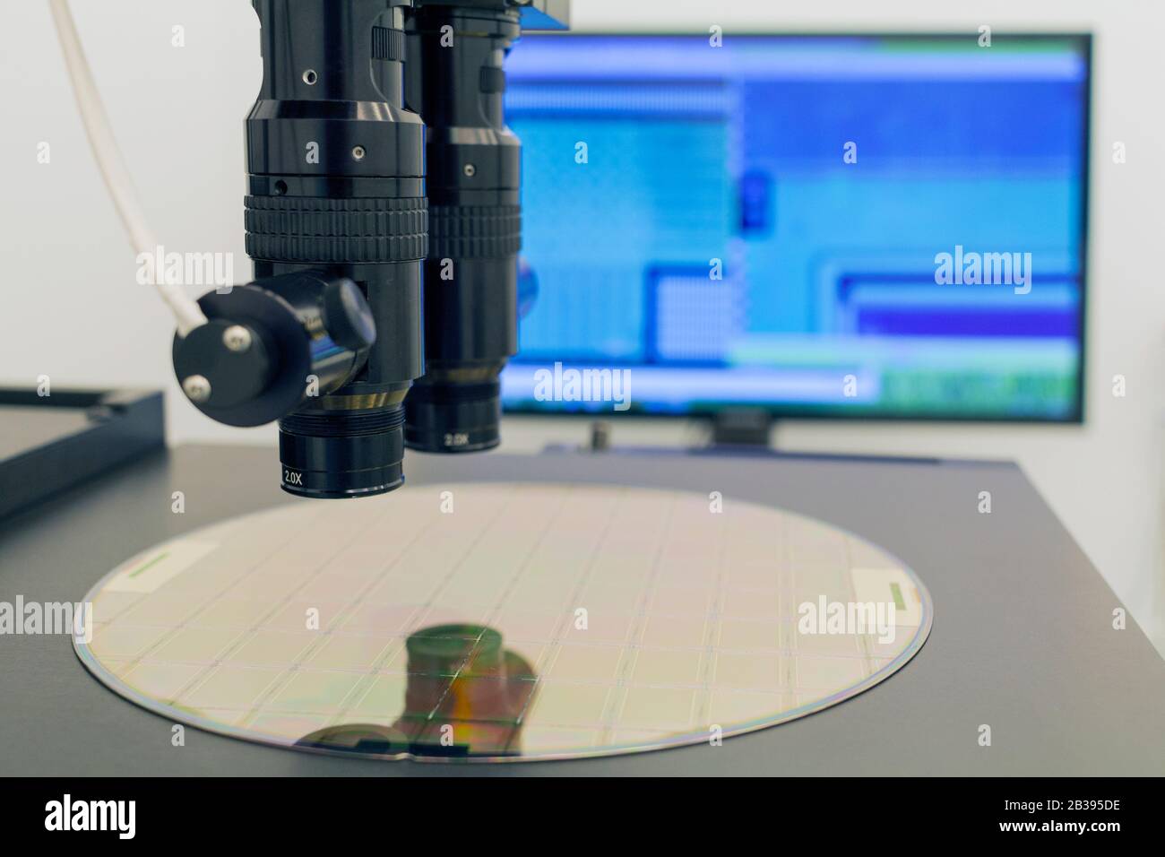 Silicon wafer on machine process examining in microscope Stock Photo ...
