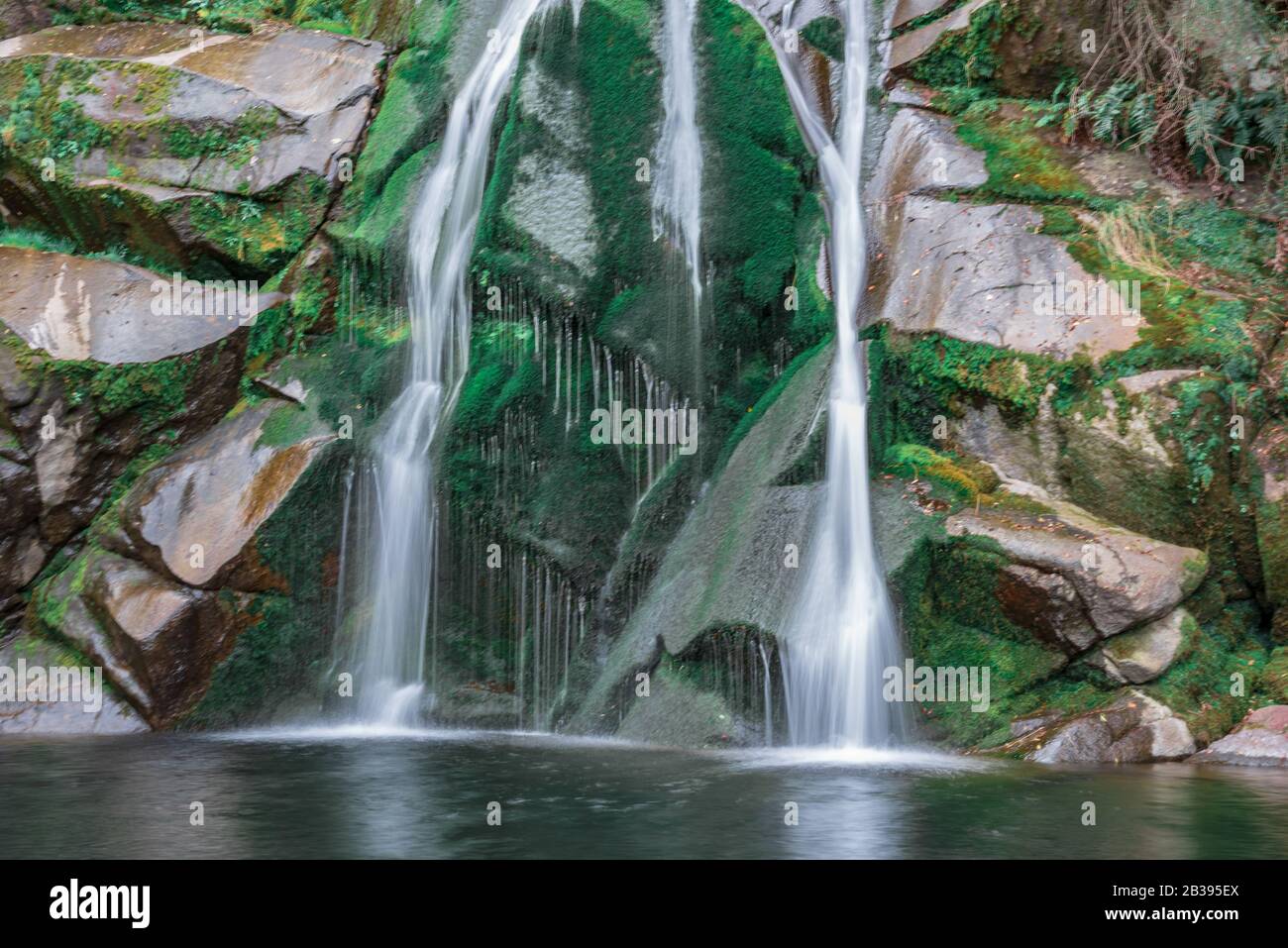 Close view of a waterfall at its bottom Stock Photo - Alamy