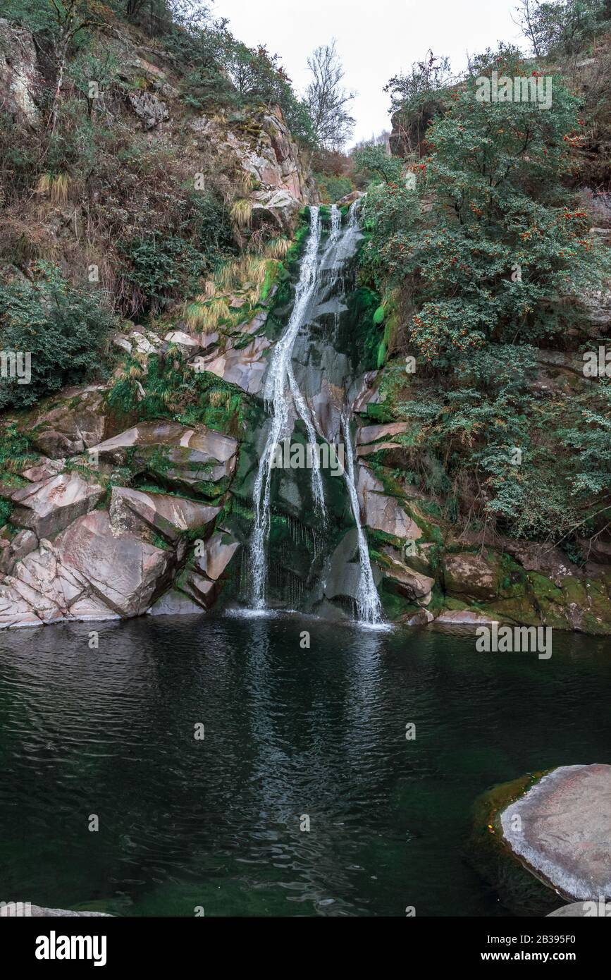 View of a complete waterfall in a forest Stock Photo - Alamy