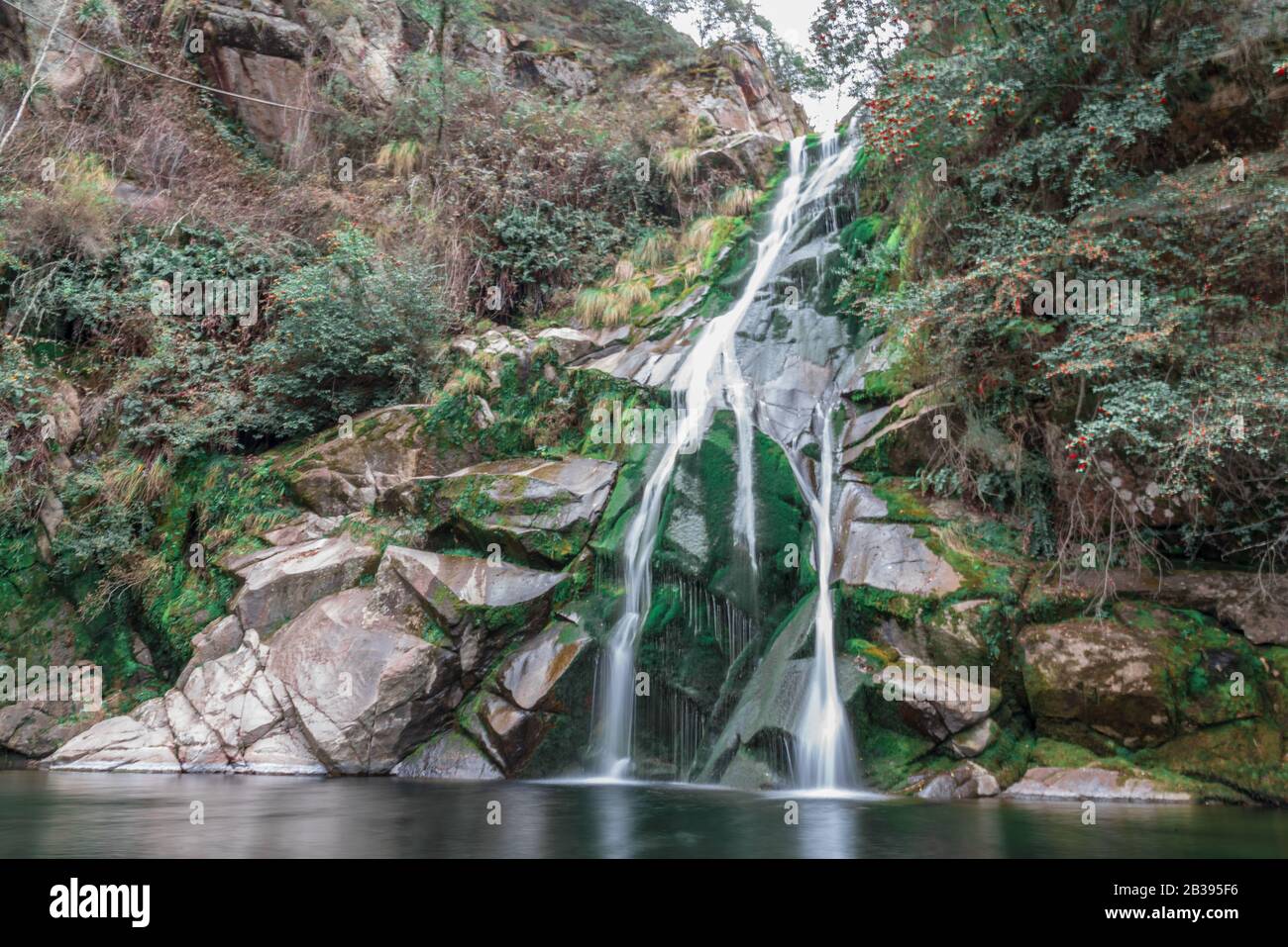 View of a complete waterfall in a forest Stock Photo - Alamy